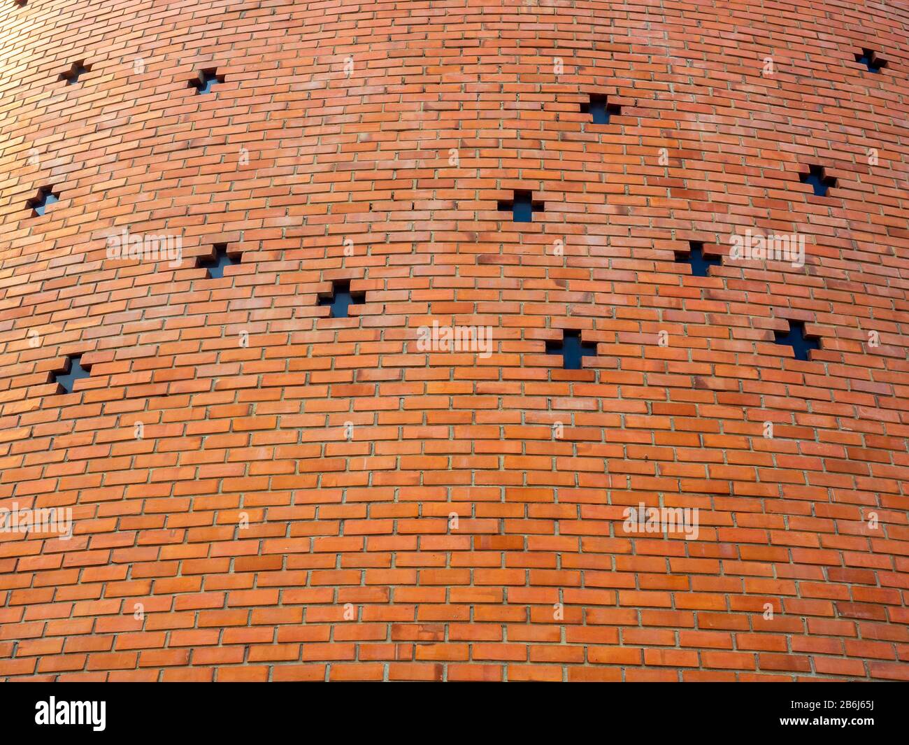 Red brick wall background with cross shaped window. Seamless brick wall ...