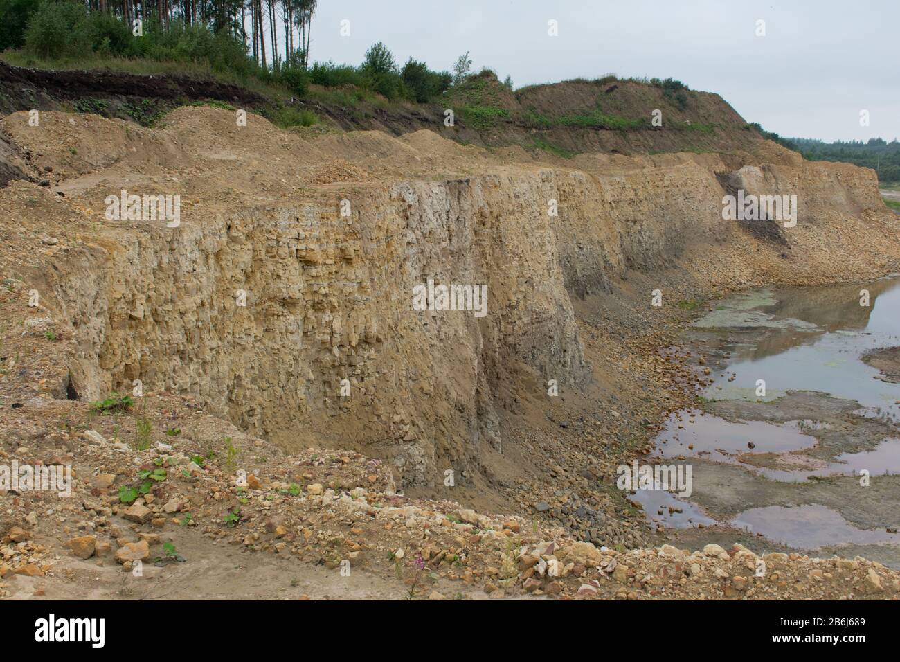 Landscape view of limestone quarry with high cliffs and canyons, and ...