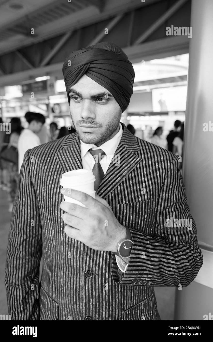 Indian man drinking coffee Black and White Stock Photos & Images - Alamy