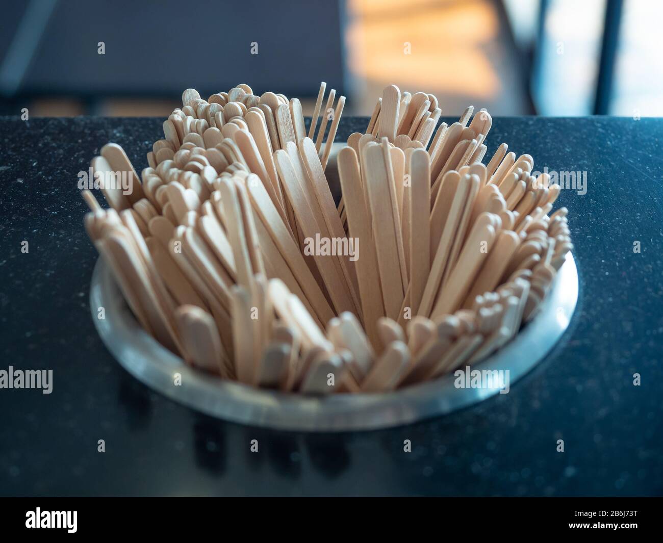 Close-up wooden stir sticks in container in coffee shop Stock Photo - Alamy
