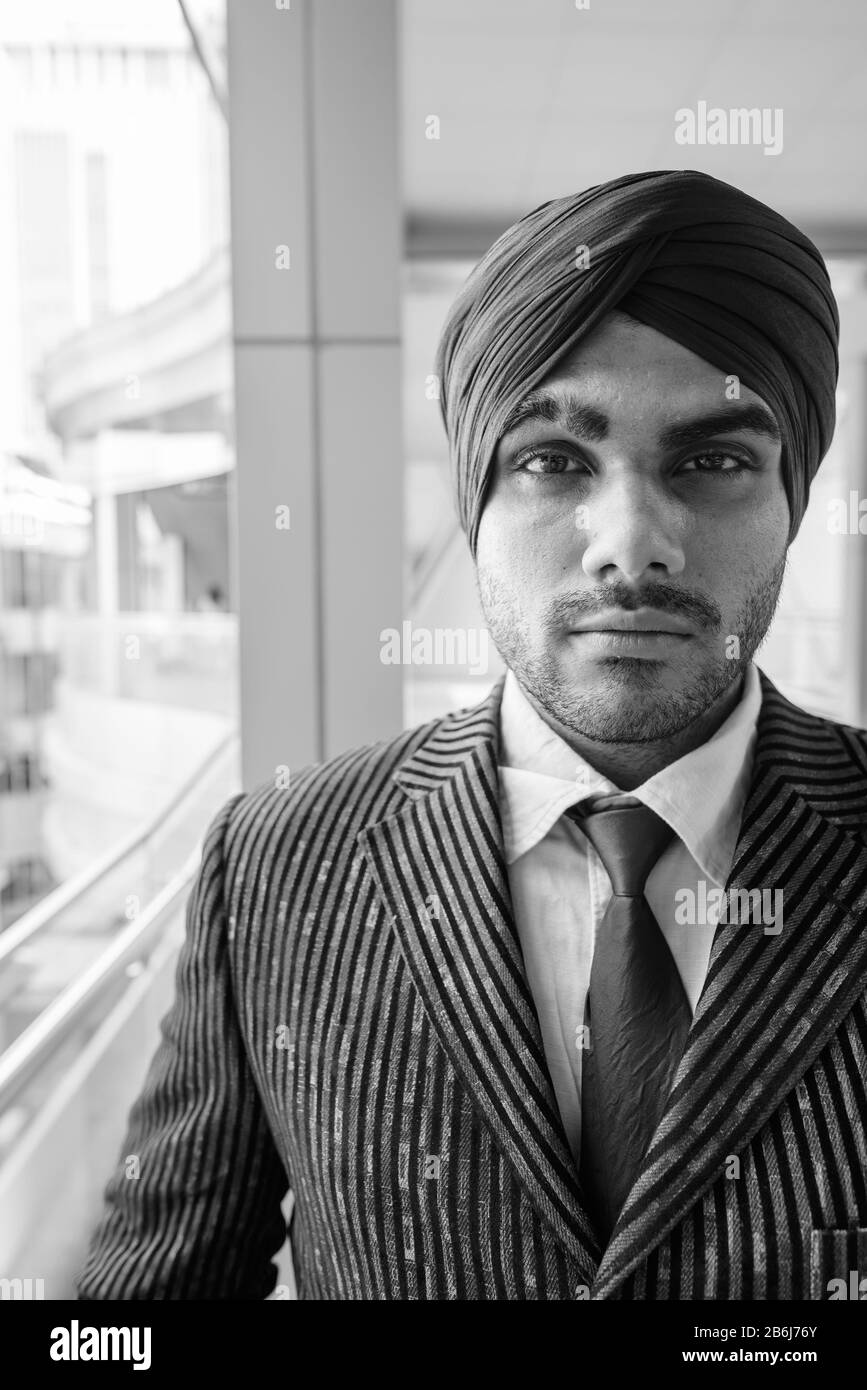 Young handsome Indian Sikh businessman wearing turban in the city Stock ...