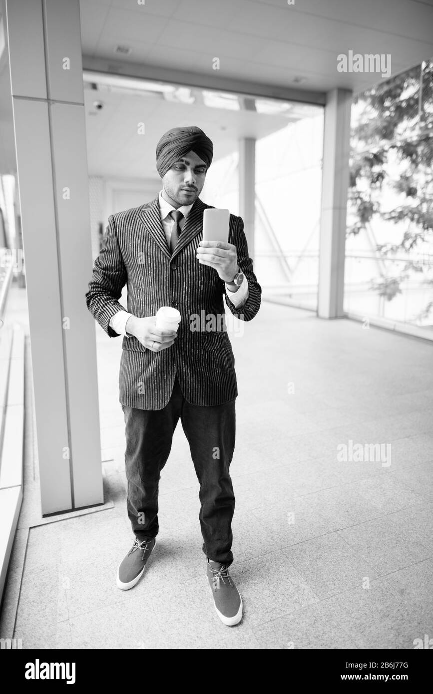 Businessman holding phone social Black and White Stock Photos & Images ...