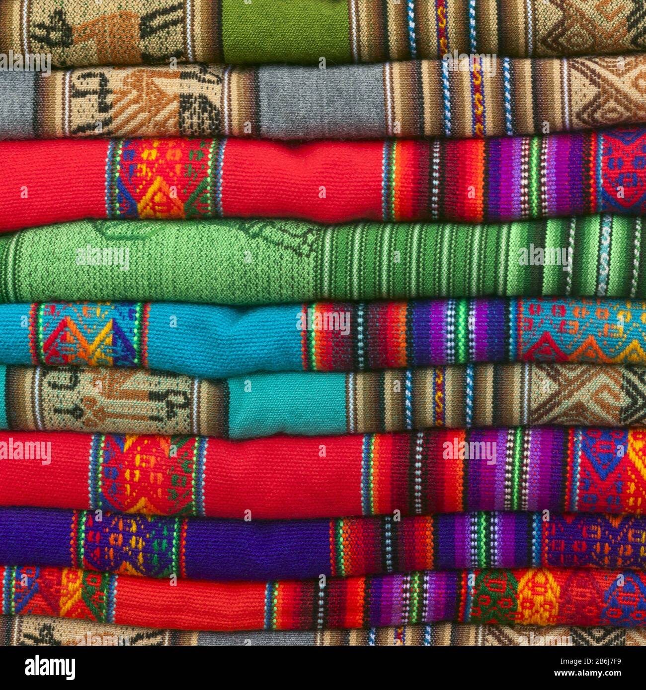 A pile of colorful Andean textiles photographed in the local handicraft ...