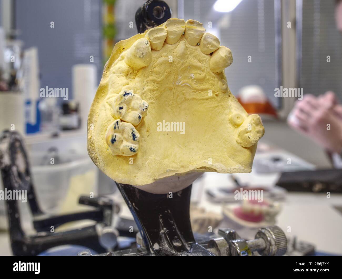 Dental gypsum articulator on the working table in dental laboratory ...