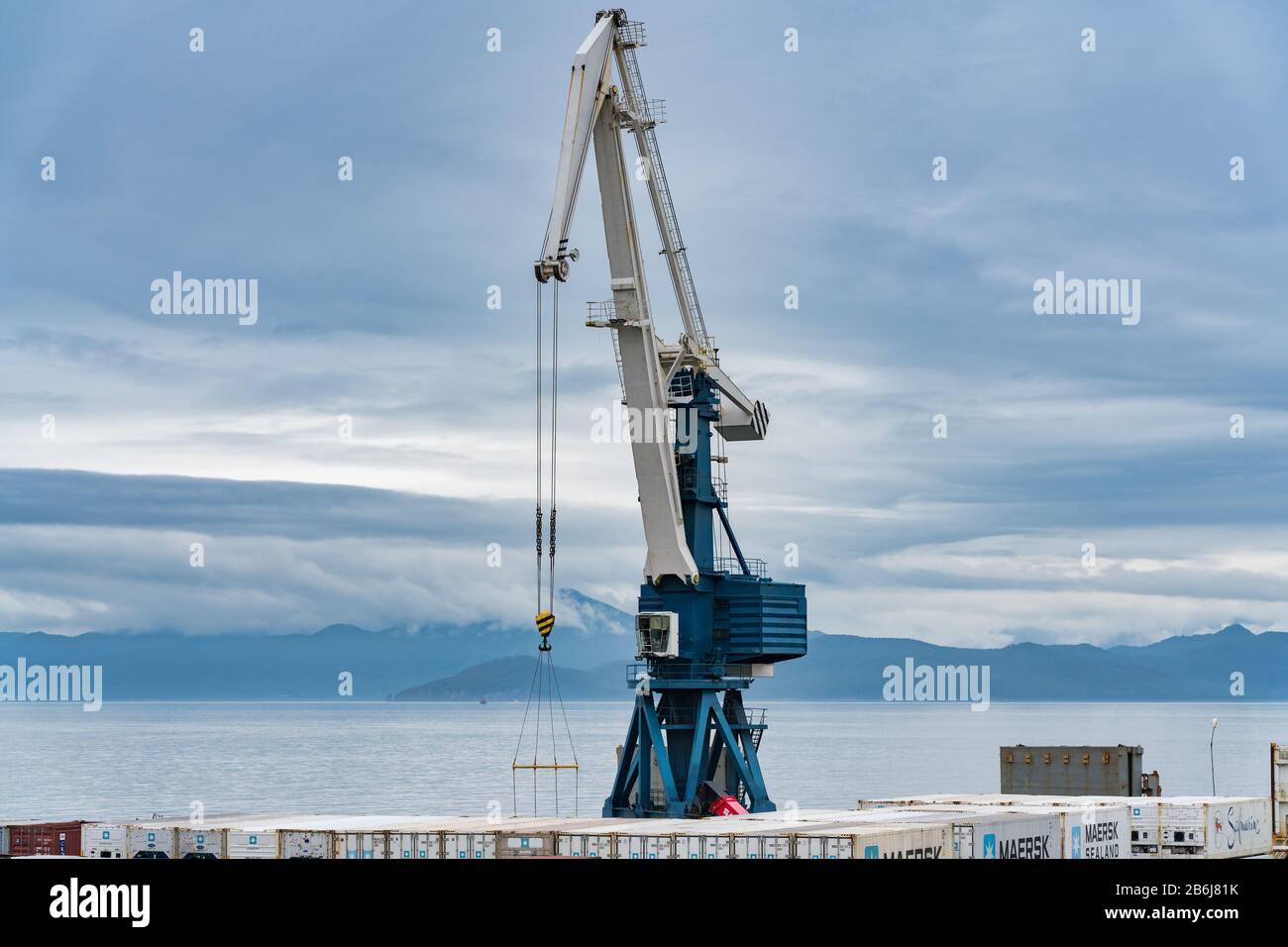 Harbor gantry-crane and many containers for shipping sea storage at ...