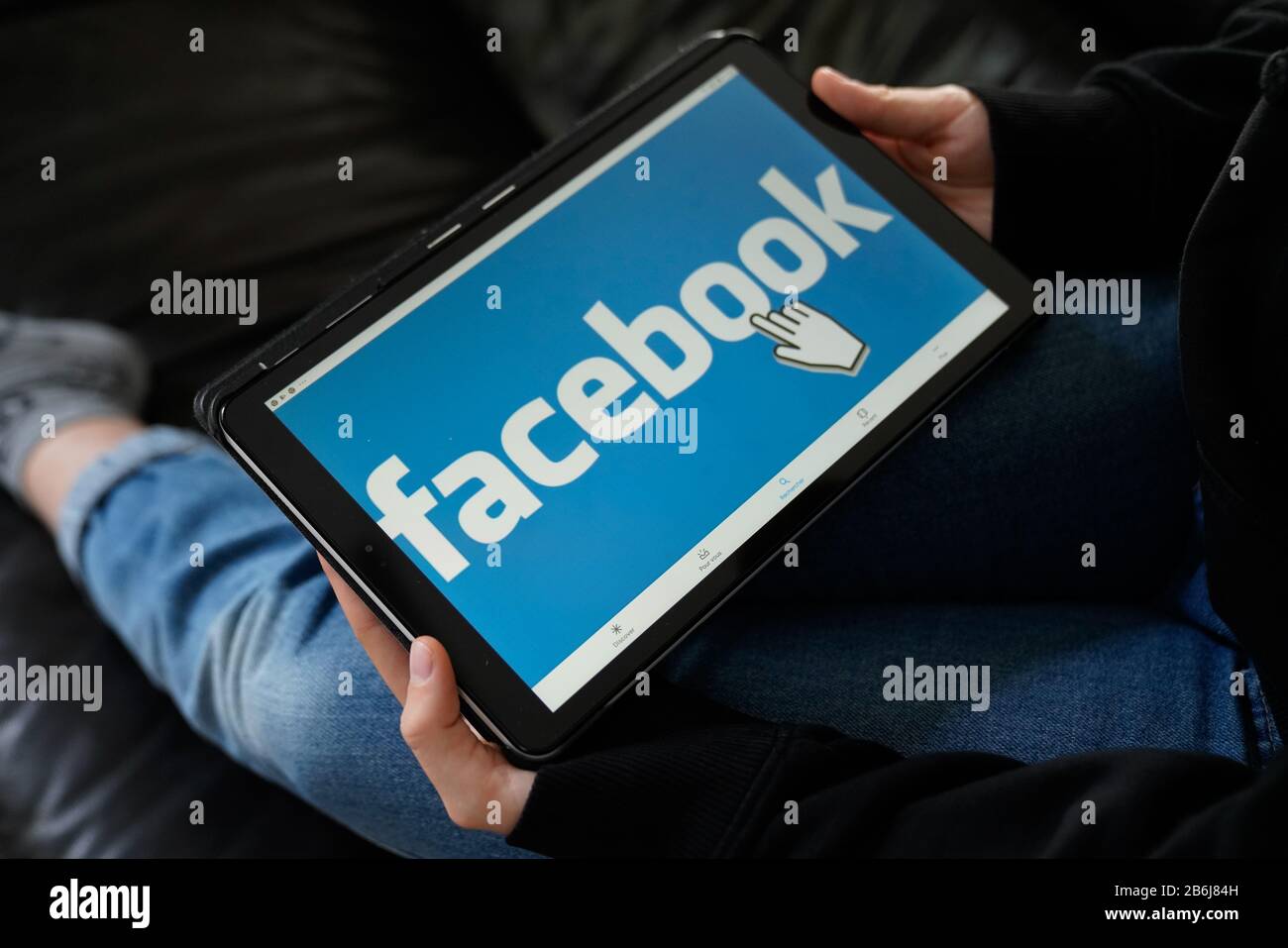 Tablet showing facebook hi-res stock photography and images - Alamy