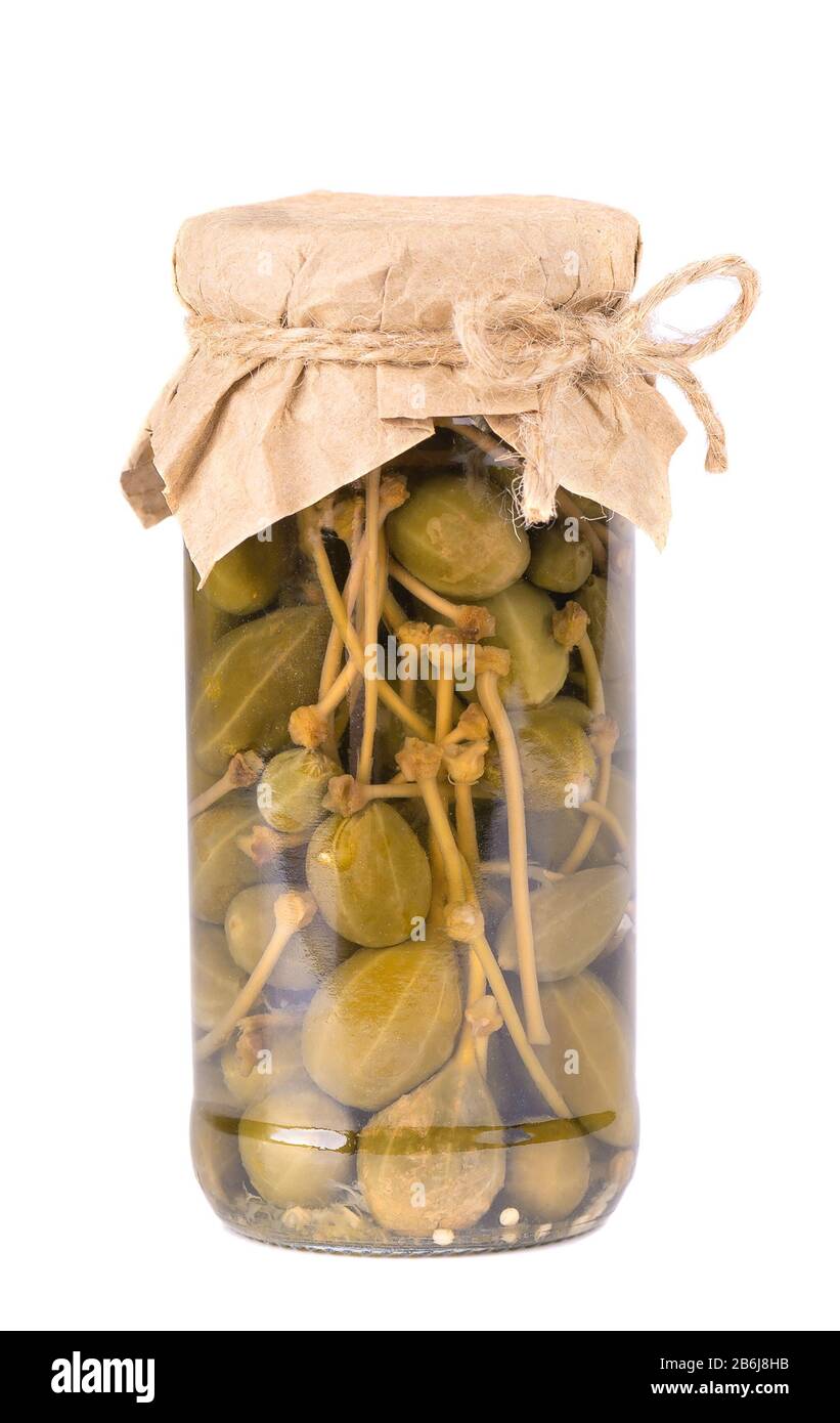 Pickled caper berries in jar isolated on white background. Capers ...