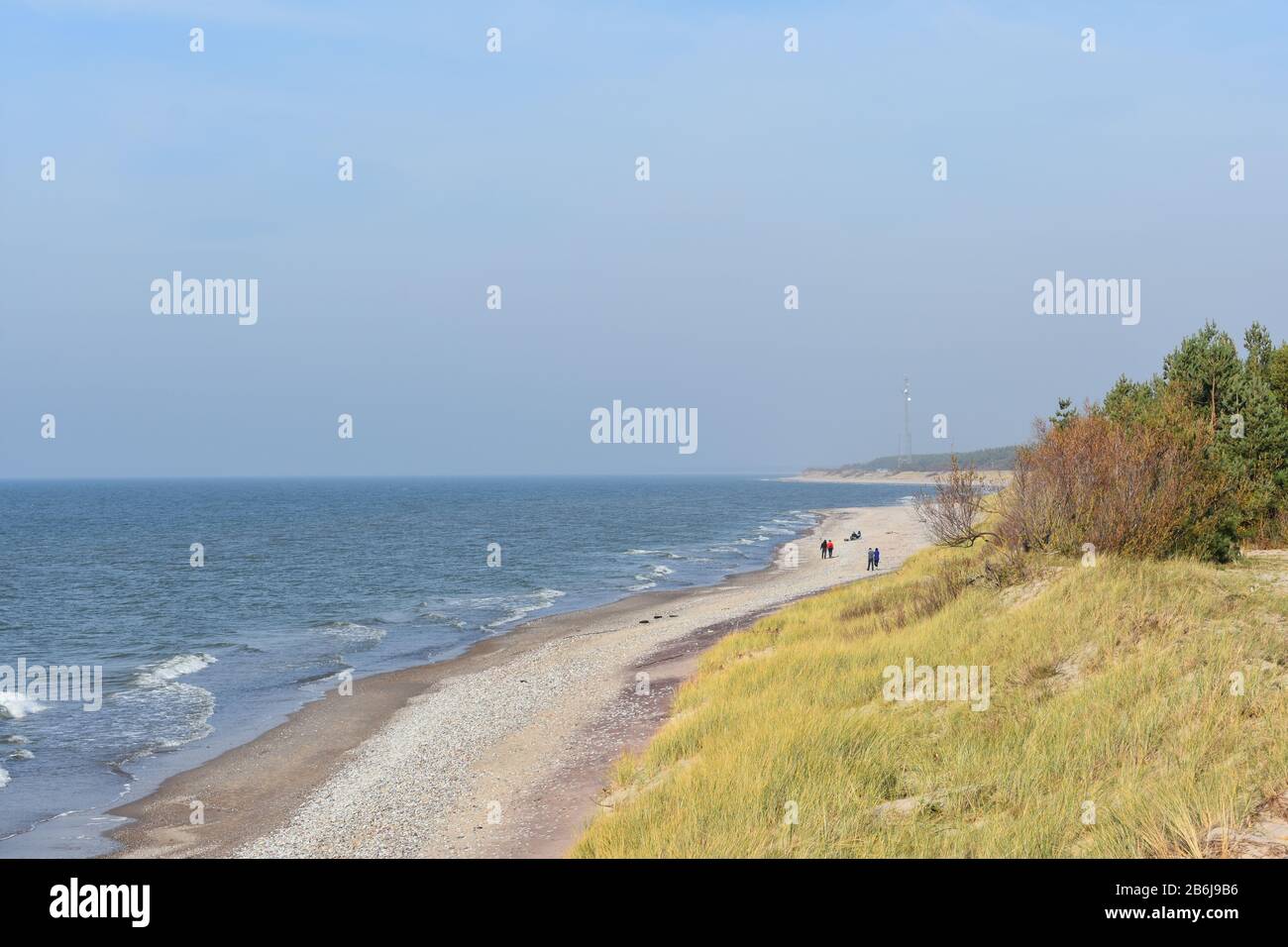 Beach landscape with steep dune coast blue sky Liepaja Skede Latvia ...