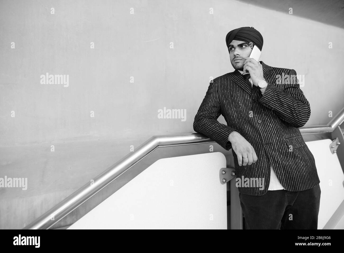 Indian man talking mobile Black and White Stock Photos & Images - Alamy