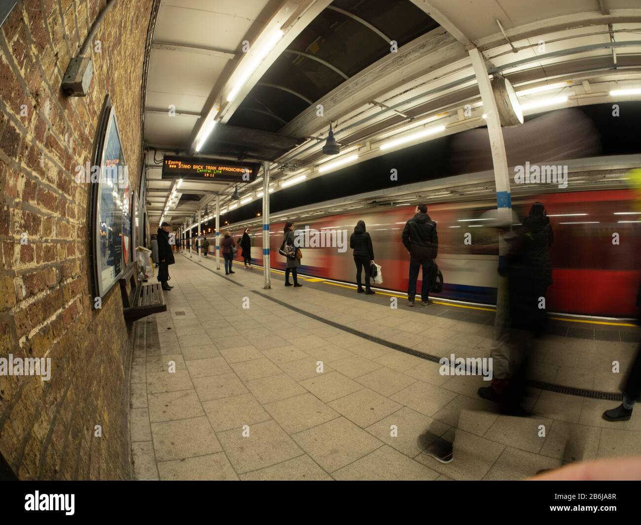 London Underground tube platform Leytonstone, with tube train arriving ...
