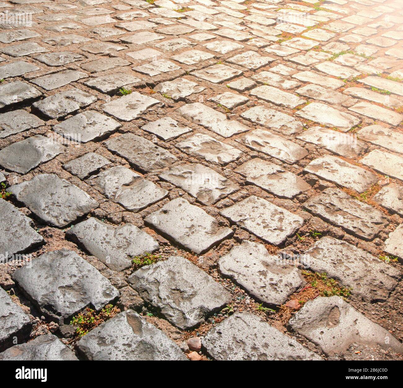 The stone pavement texture with sun light Stock Photo - Alamy