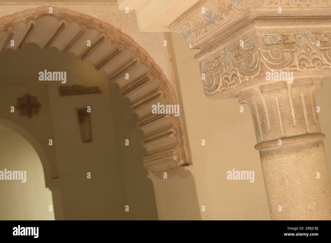 Chapiter column and Nasrid arch in palace of Alcazaba, Malaga, Spain ...