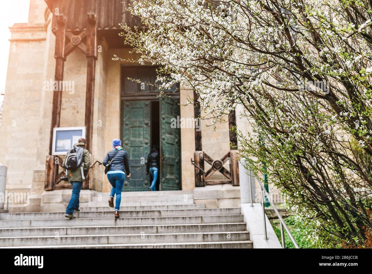 Group of people enter the doors of Church Stock Photo - Alamy