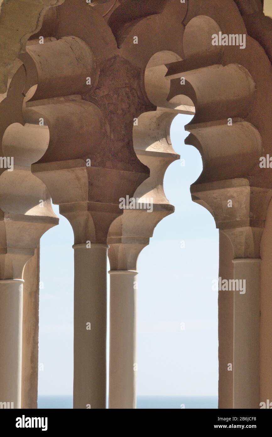 Multifoil arches of Nasrid style in Alcazaba, ancient muslim palace ...