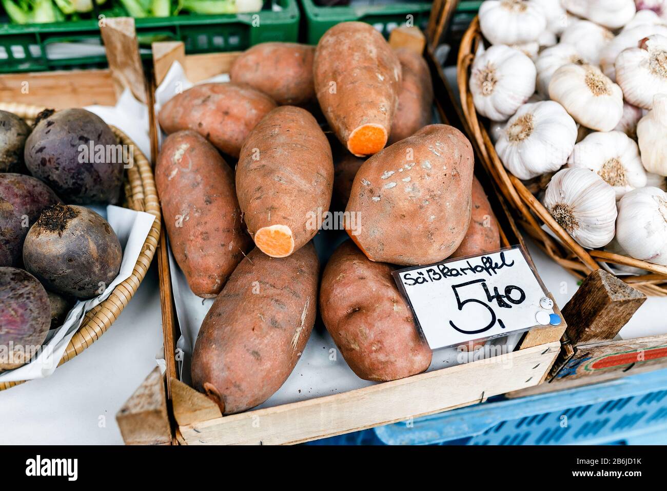 sweet potato on table counter at farm market place with price tag in ...
