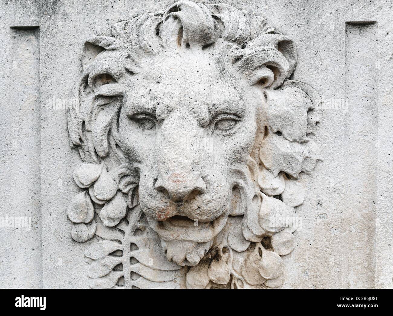 old Lion head relief on the facade Stock Photo - Alamy