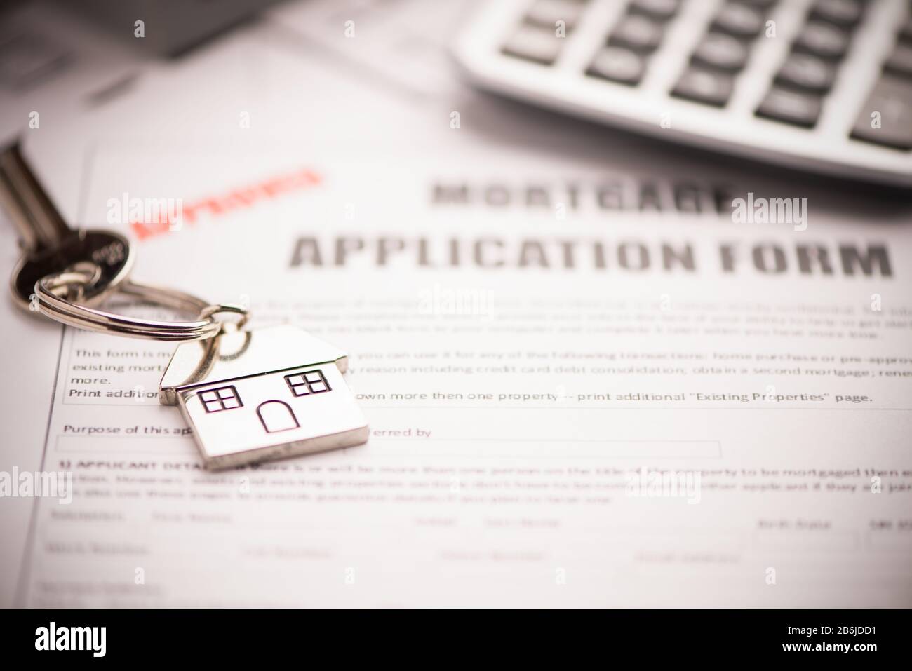 An empty mortgage application form with house key business working ...