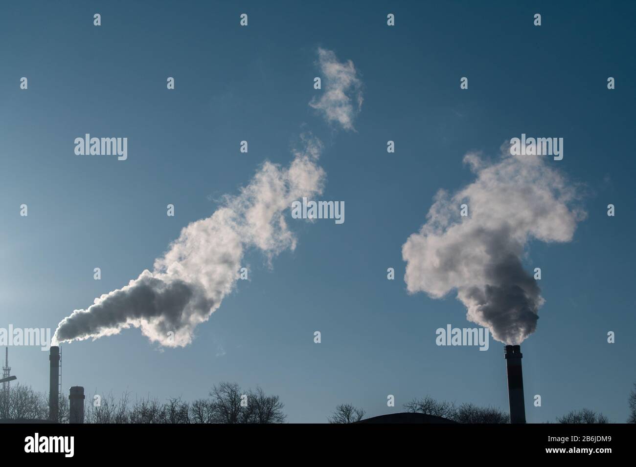 Smoking industrial chimneys. Smoking power plant. White smoke against ...