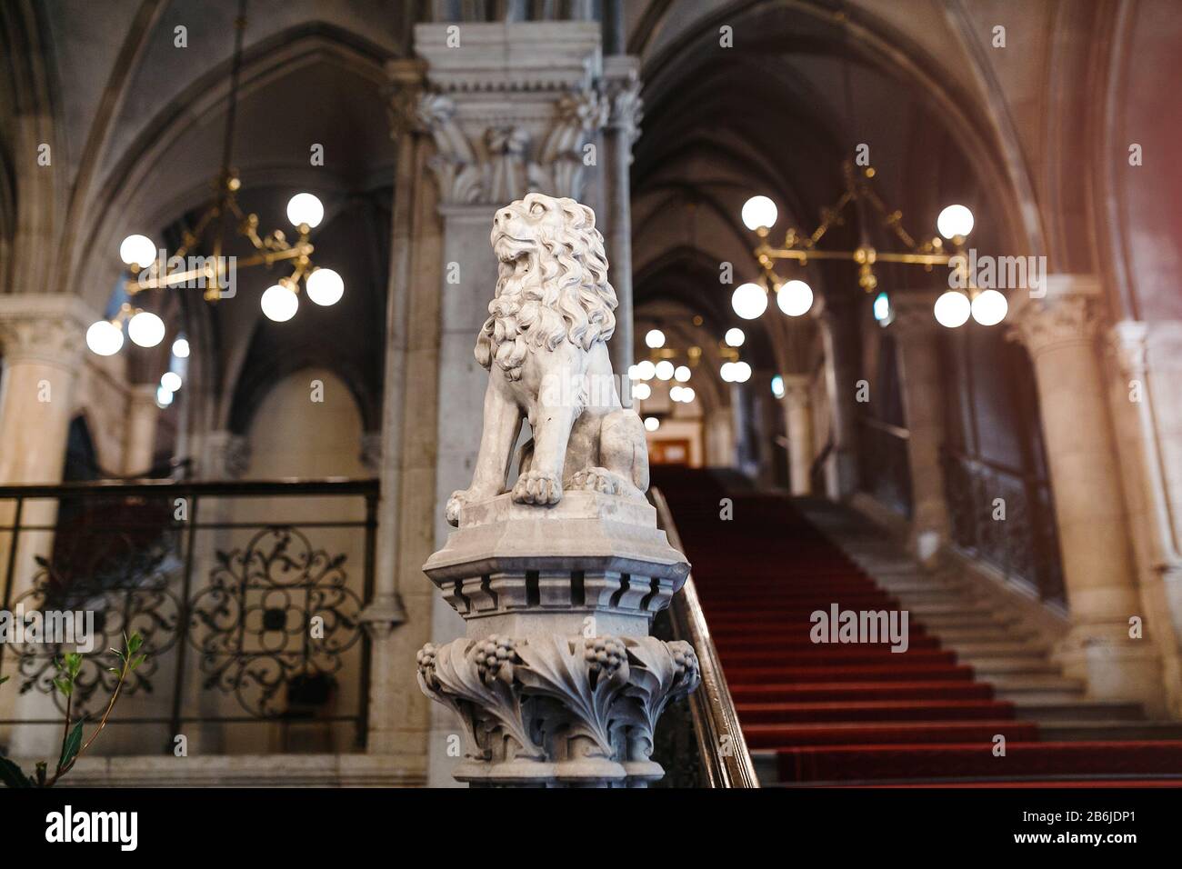 lion statue in the luxury interior with staircase Stock Photo - Alamy