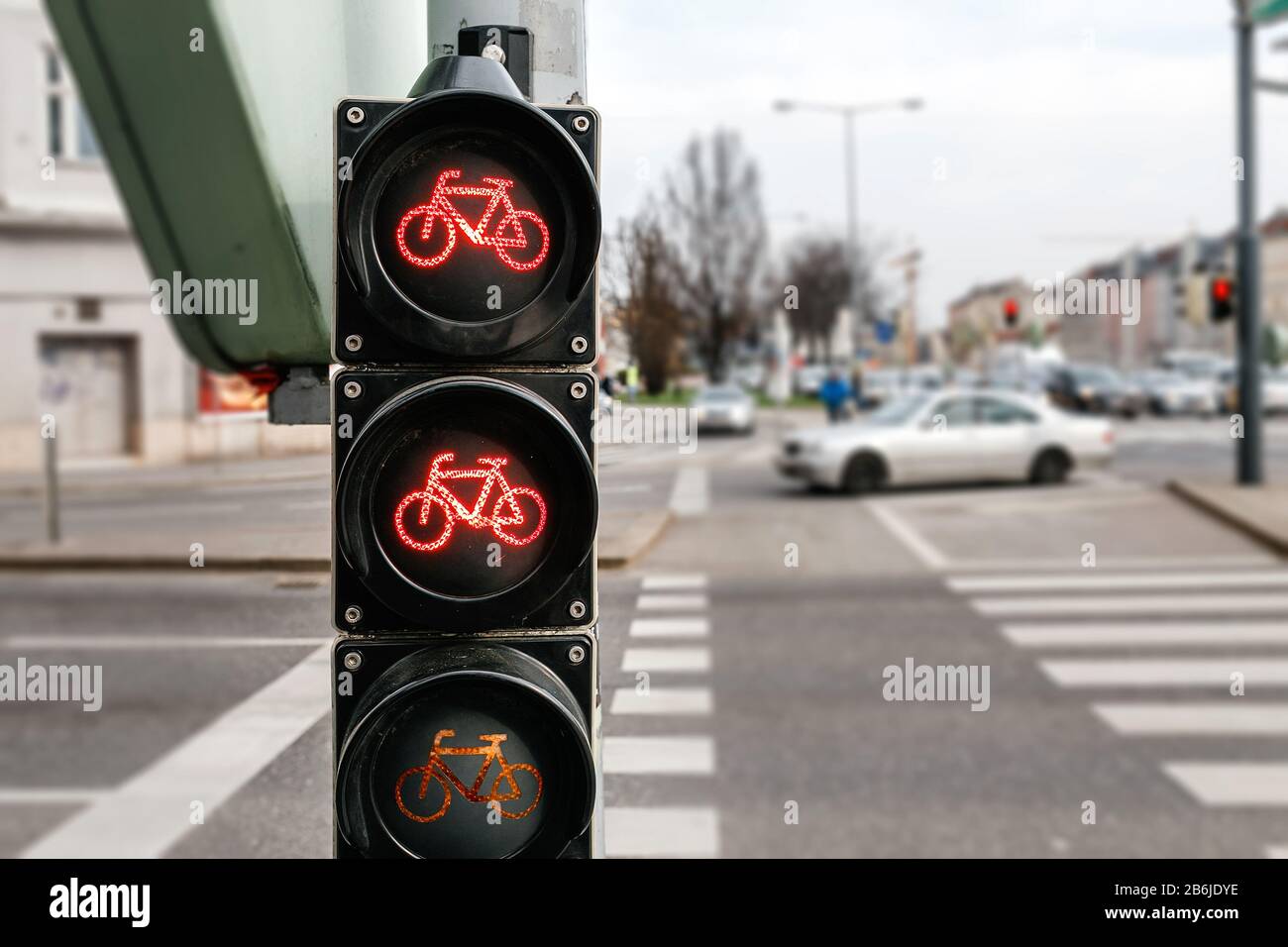 Red bicycle traffic lights on the city street background Stock Photo ...