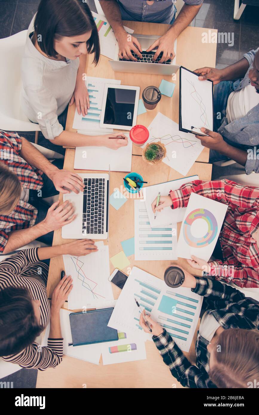 Top view of working table of multiethnic young managers preparing for ...