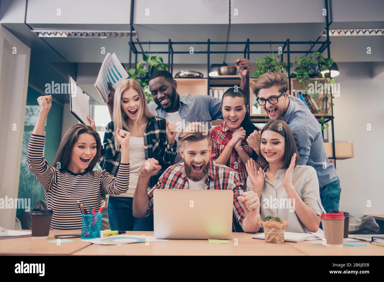 Yes! Happy multinational young managers successfuly completed hard ...