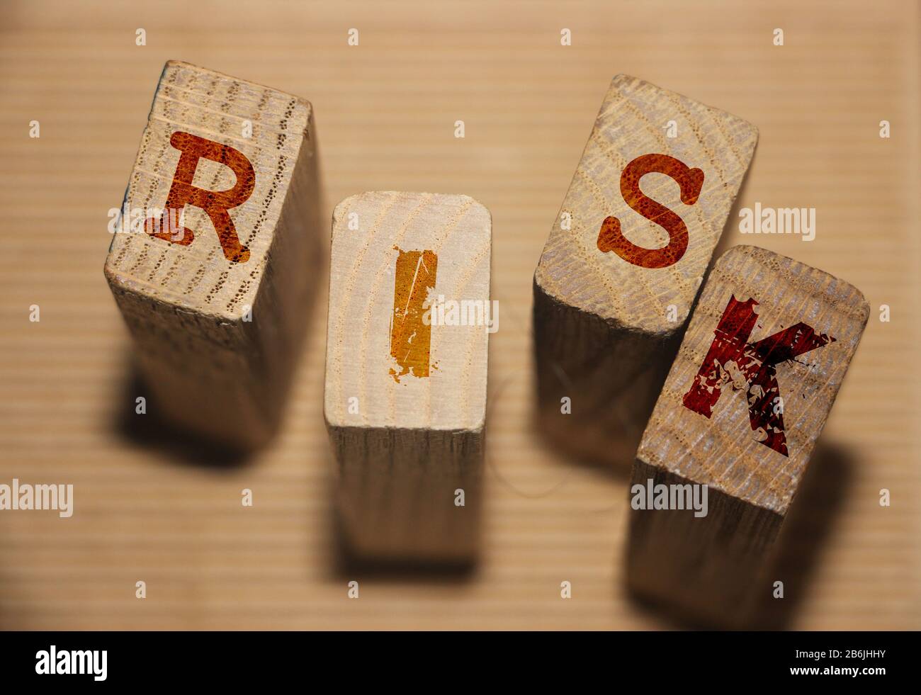 Wooden block with alphabet building the word RISK, business investment ...
