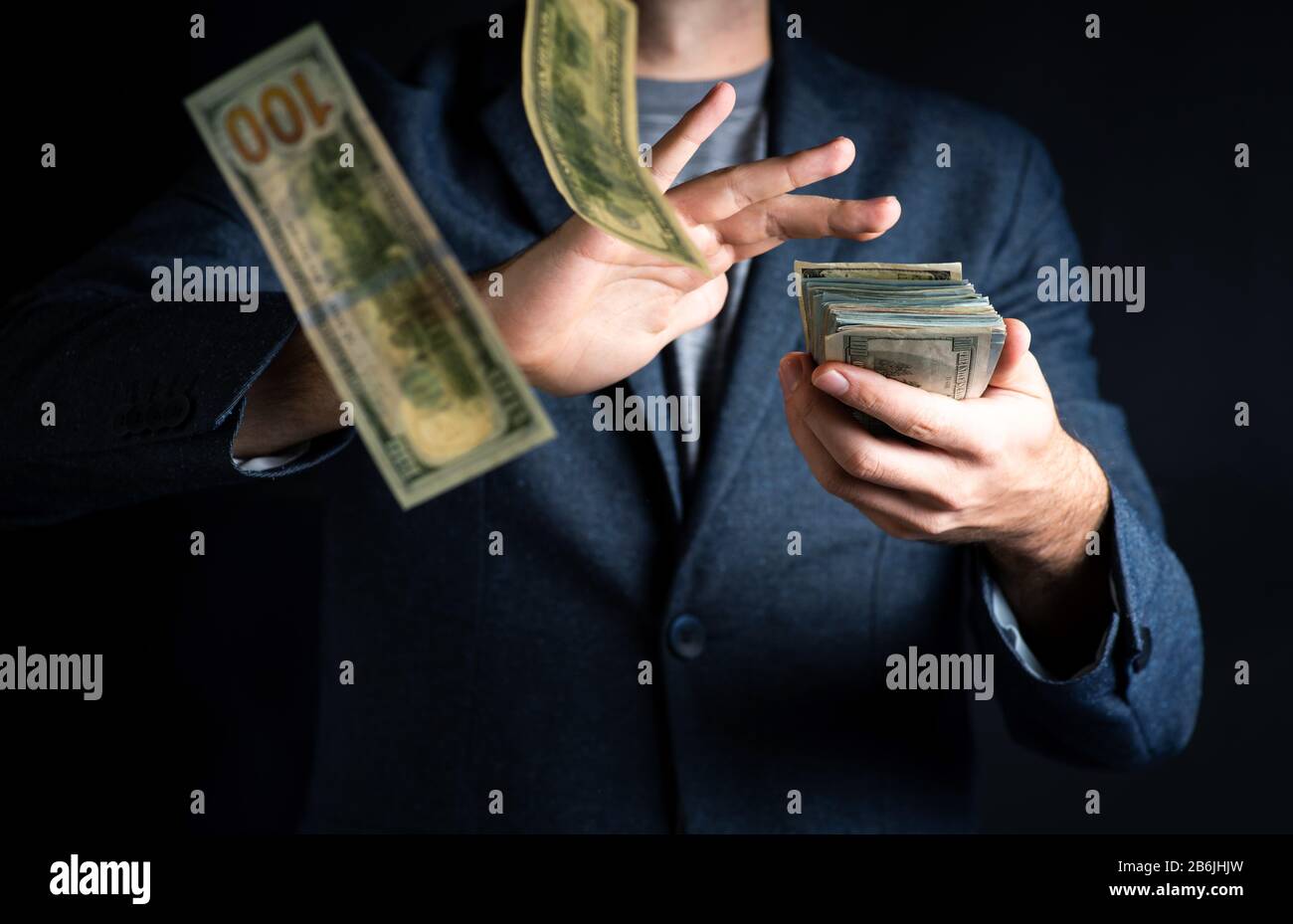 Throwing money man hi-res stock photography and images - Alamy