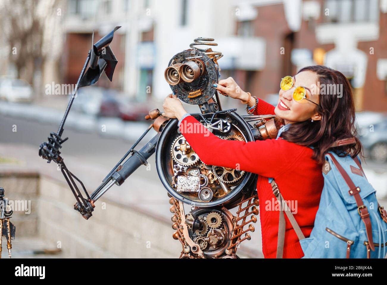 28 APRIL 2018, UFA, RUSSIA: Woman touching robot statue created from ...