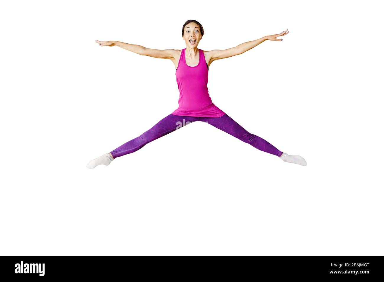 Eastern fitness woman jumping in sporty clothes isolated on white ...