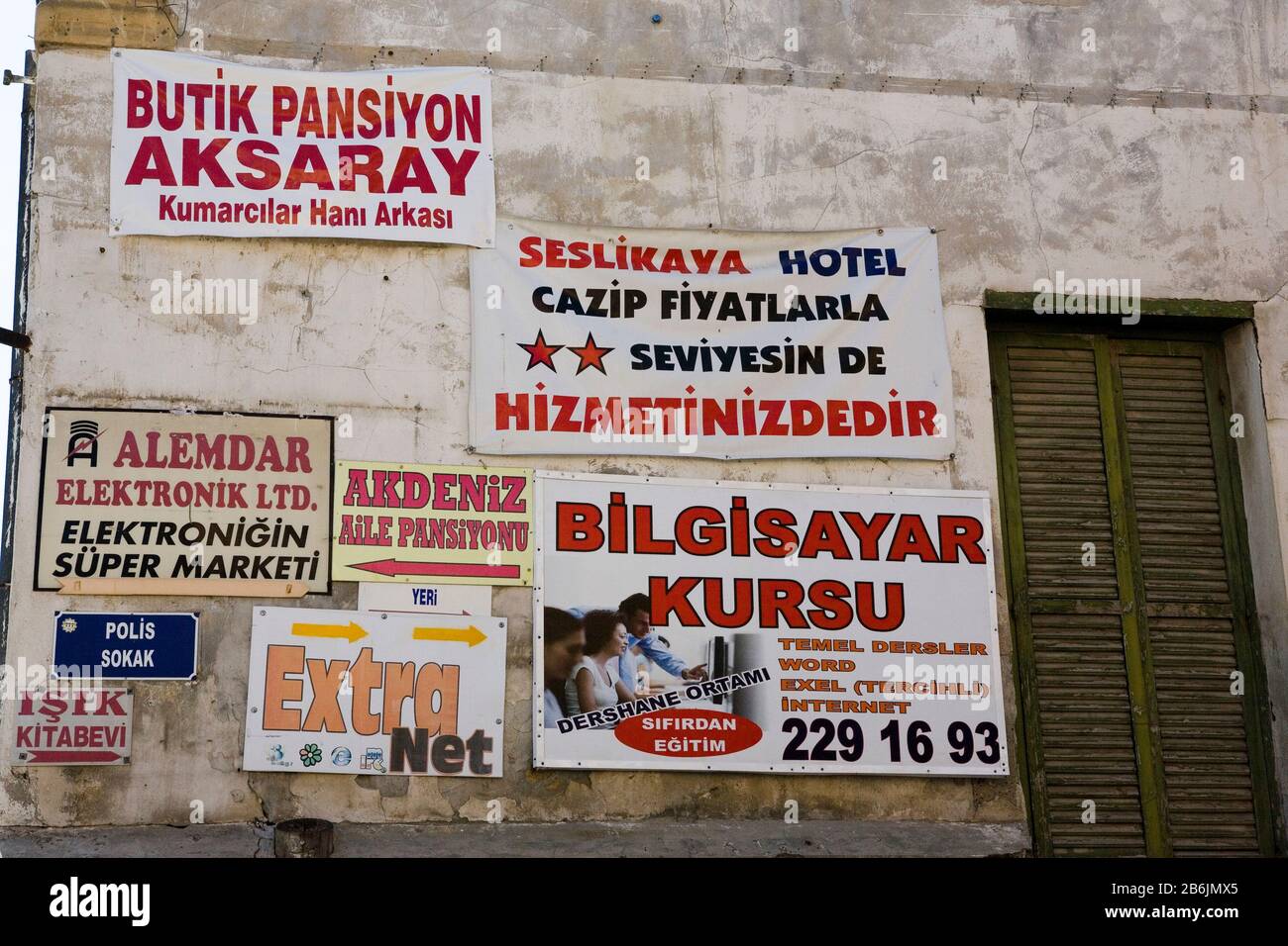 Turkish signs and advertisements, corner of Polis Sokak and Girne ...