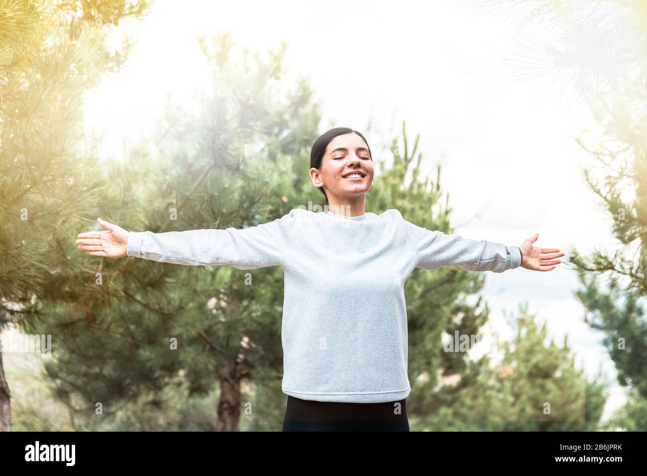 soul and body freedom. attractive woman with arms open and eyes closed ...