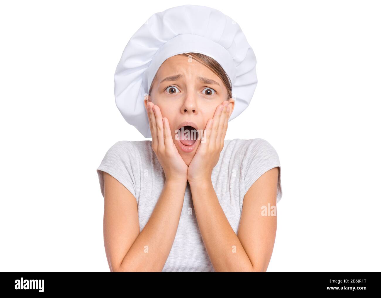 Teen girl in chef hat Stock Photo - Alamy