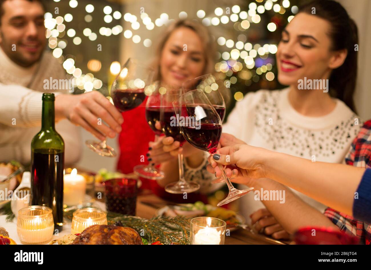 holidays and celebration concept - close up of happy friends having ...