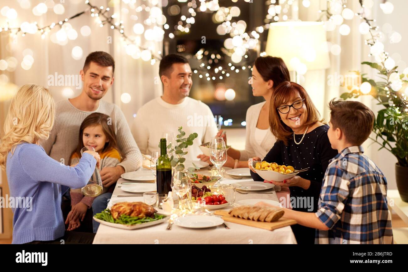 celebration, holidays and people concept - happy family having dinner party at home Stock Photo ...