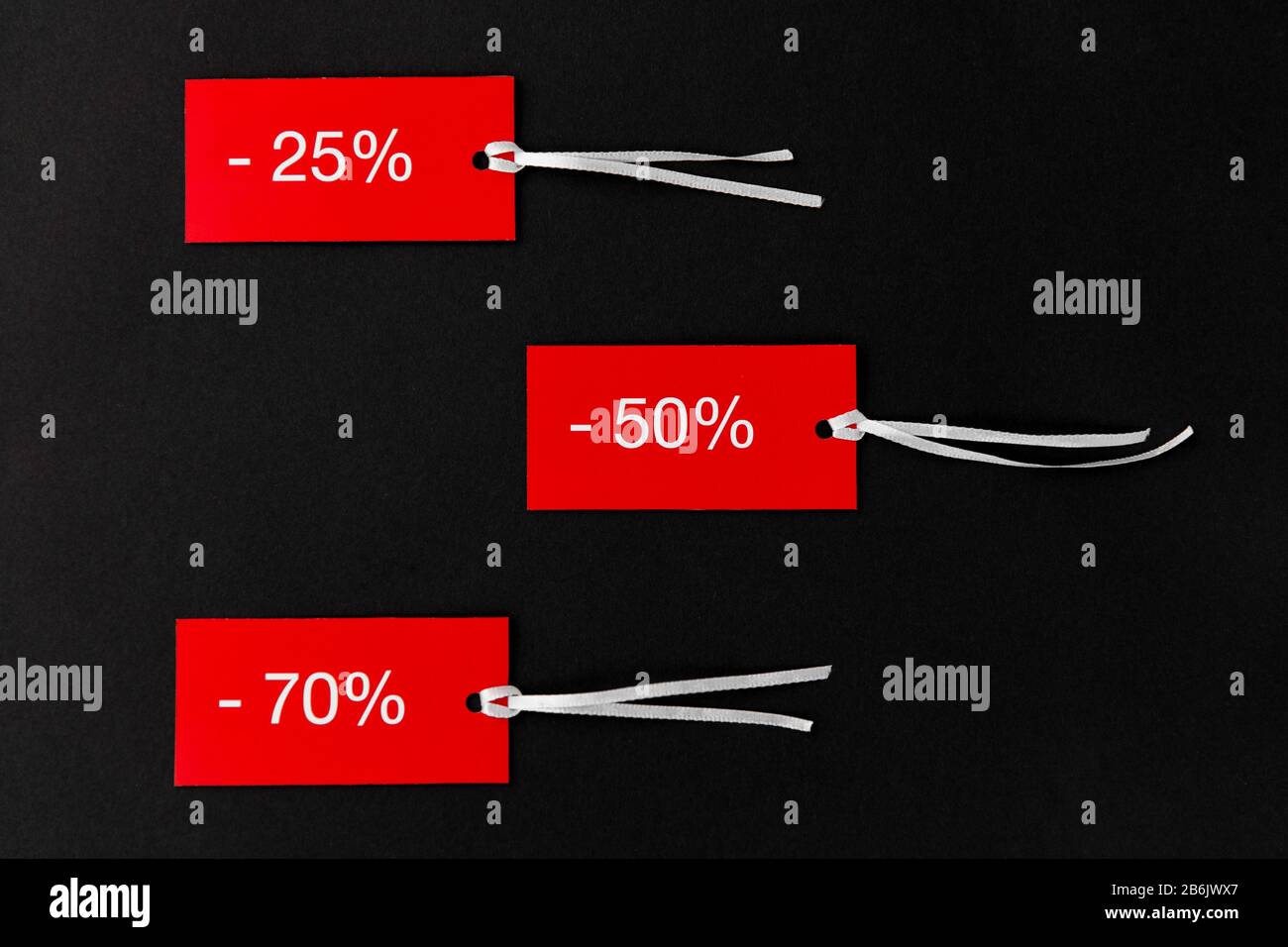 shopping, sale and outlet concept - red tags with discount signs on ...