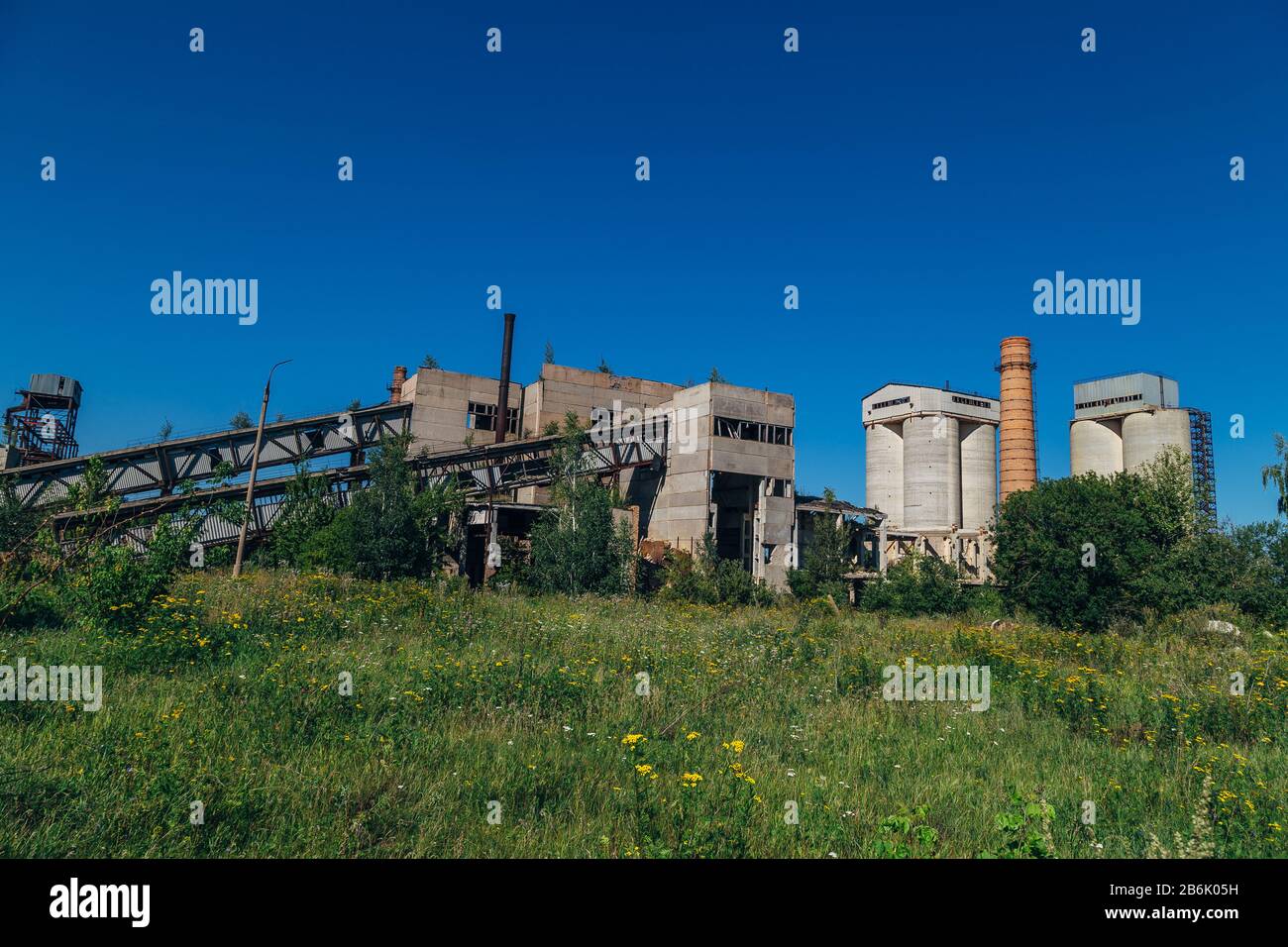 Old overgrown abandoned factory of reinforced concrete Stock Photo - Alamy