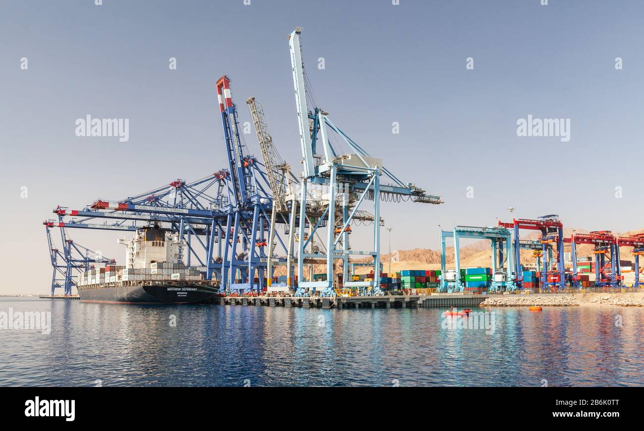 Aqaba, Jordan - May 17, 2018: Gantry cranes load container ship ...