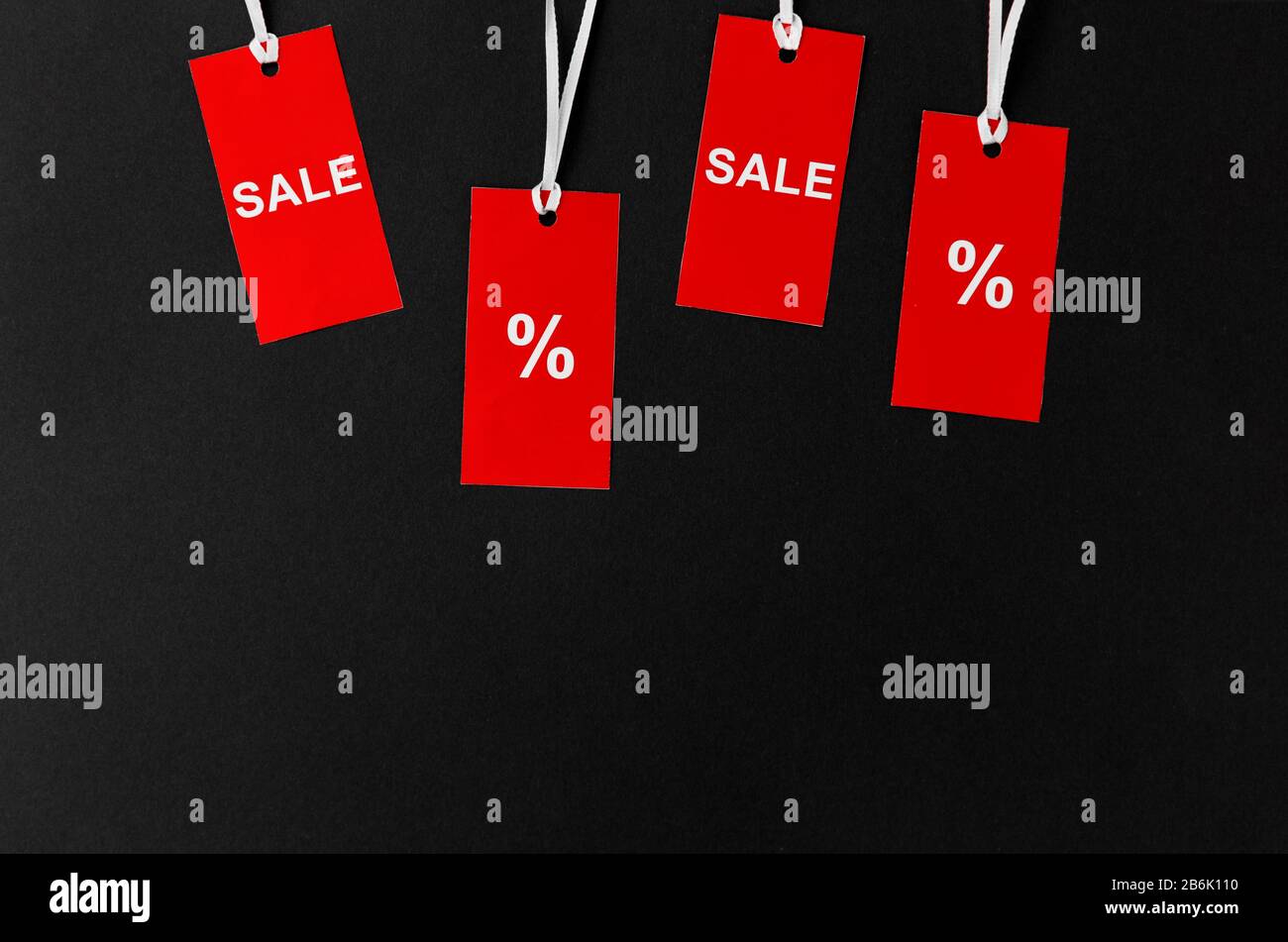shopping, sale and outlet concept - red tags with discount signs on ...