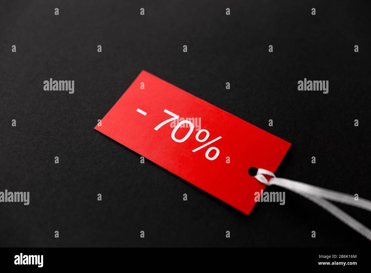 shopping, sale and outlet concept - red tags with discount signs on ...