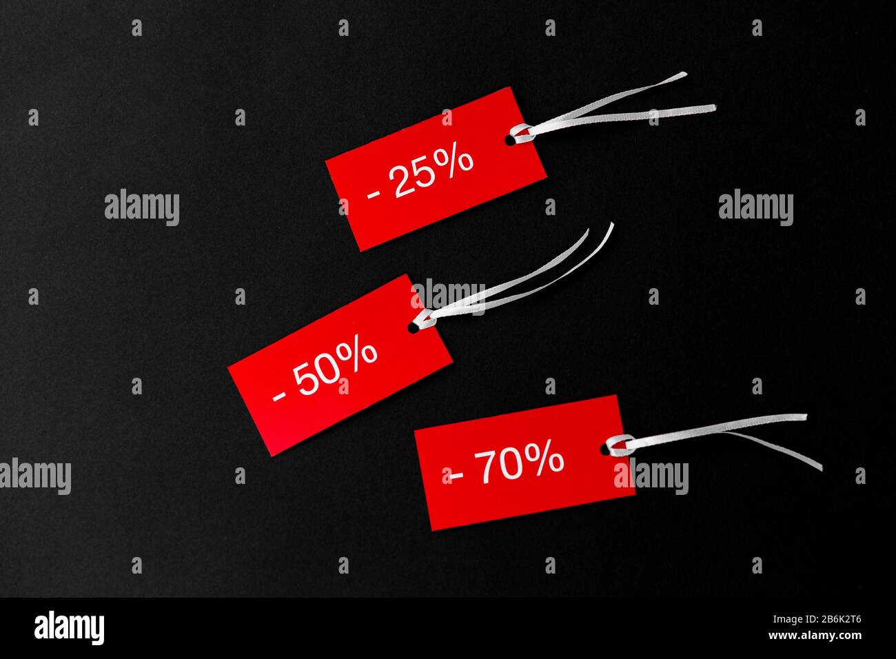 shopping, sale and outlet concept - red tags with discount signs on ...