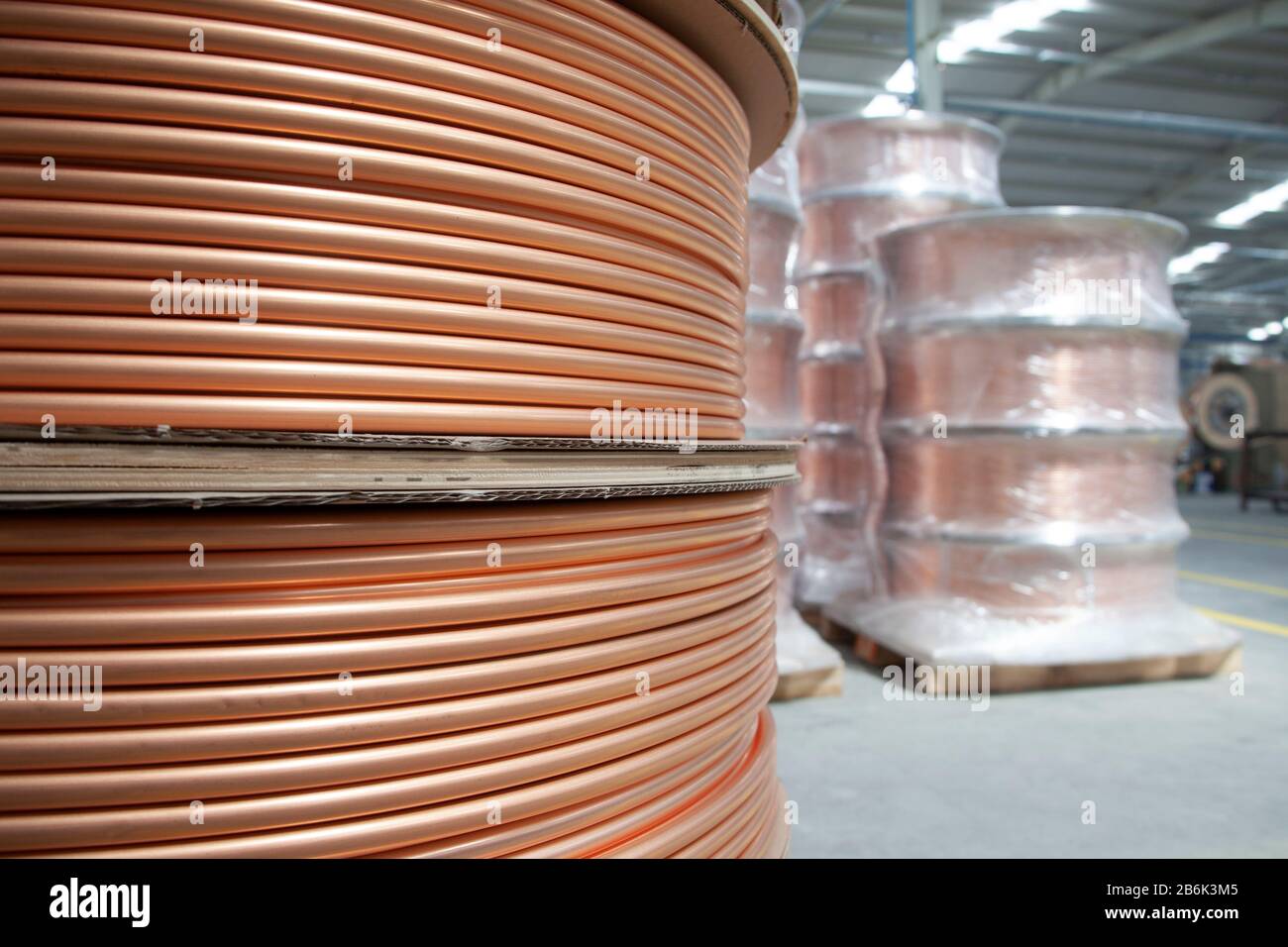 new copper pipes at the factory Stock Photo - Alamy