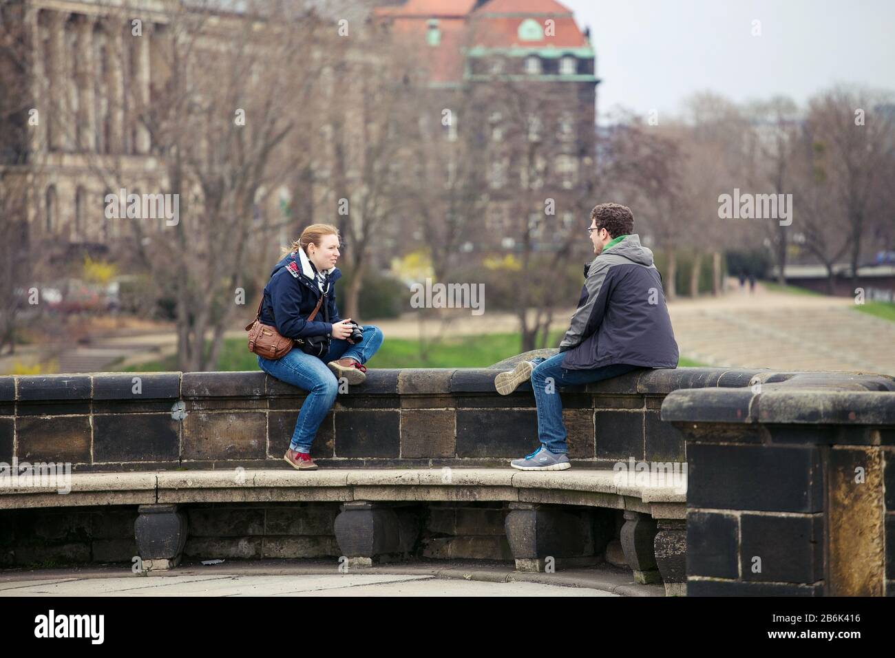 Two people facing each other talking hi-res stock photography and ...