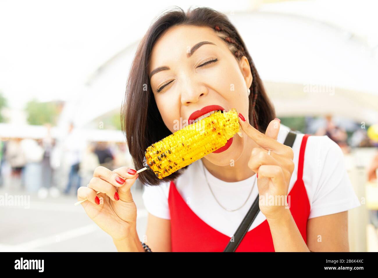 Woman Eating Corn On The Cob