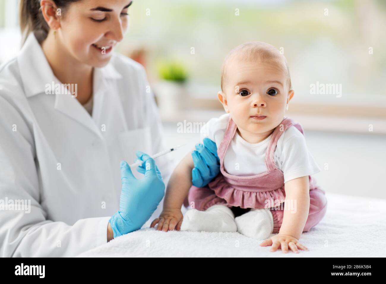 medicine, healthcare and vaccination concept - female pediatrician ...