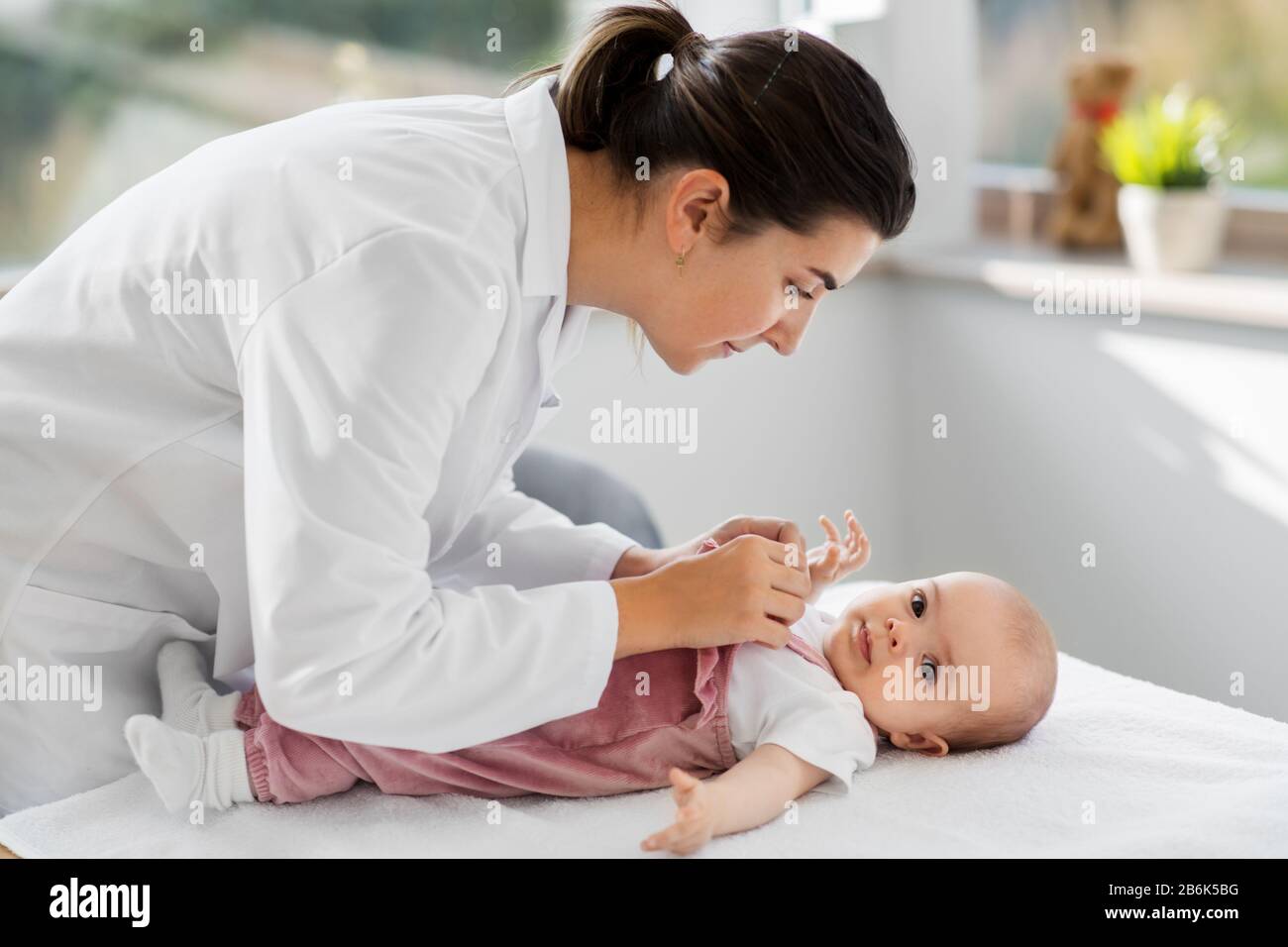 medicine, healthcare and pediatrics concept - female pediatrician ...