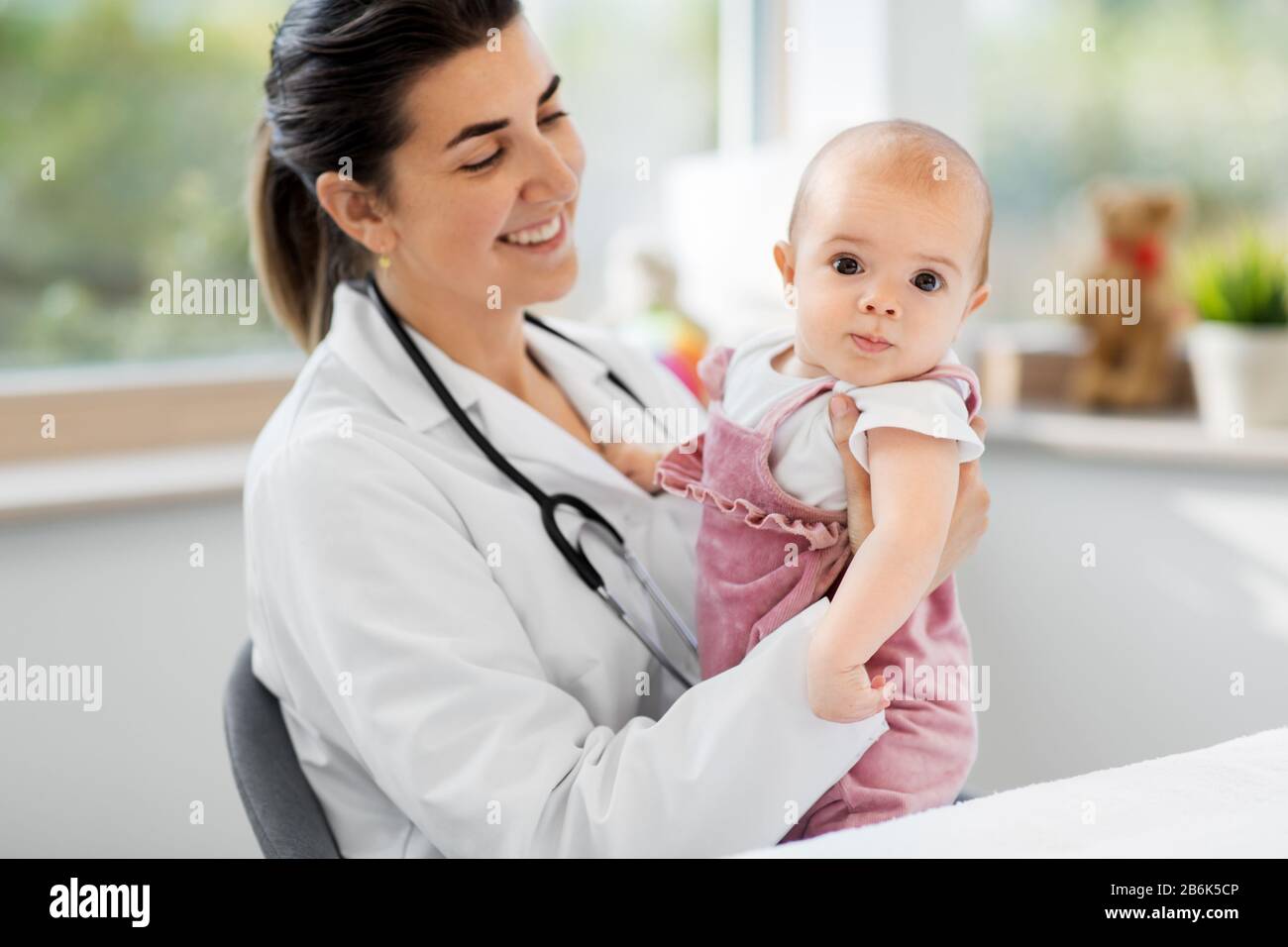 medicine, healthcare and pediatrics concept - smiling female ...