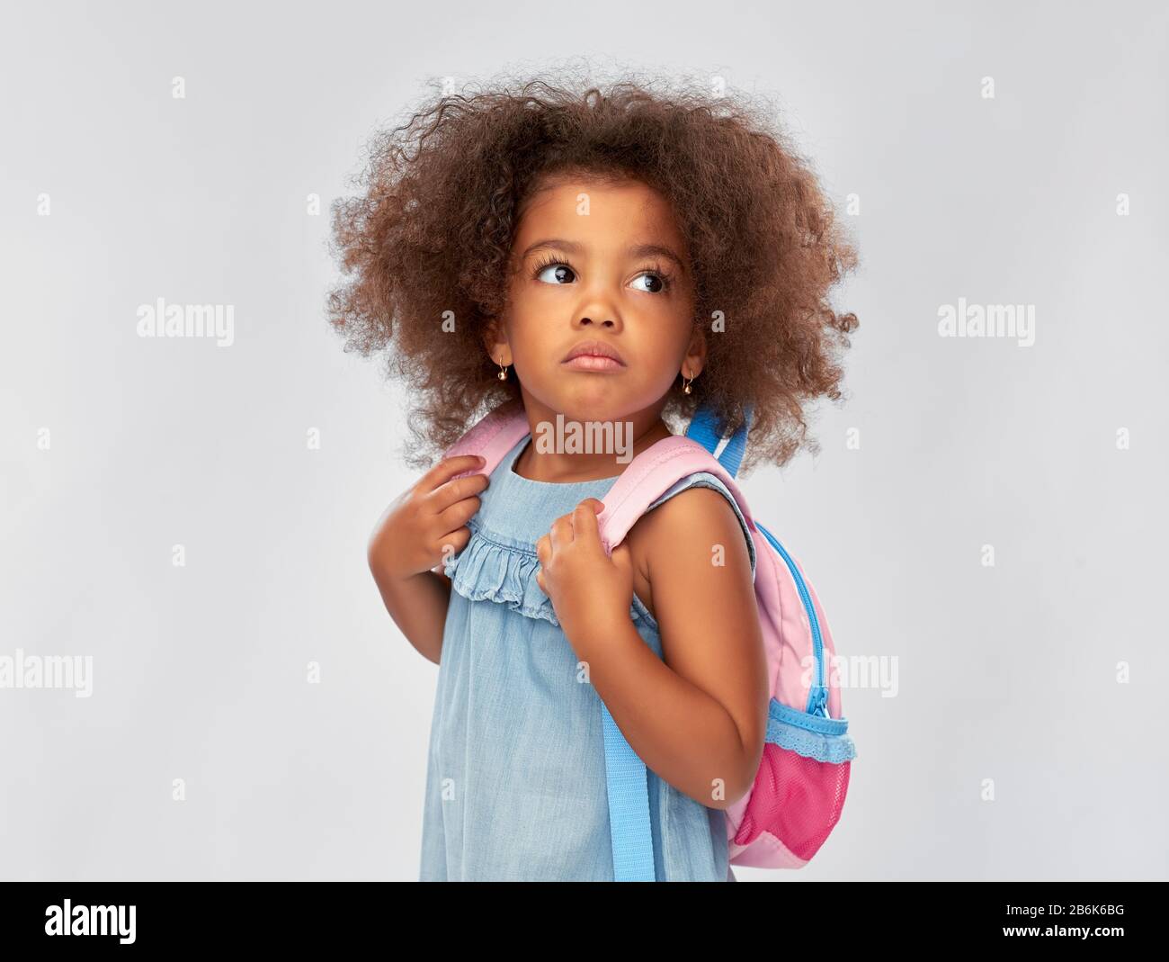 childhood, school and education concept - sad little african american ...