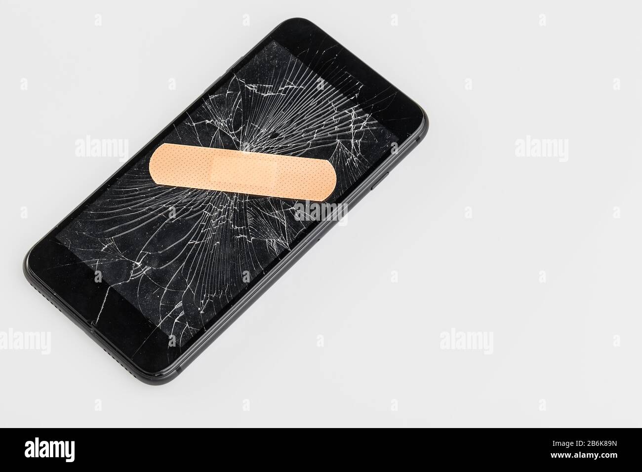 Mobile phone with broken screen creative photo Stock Photo - Alamy
