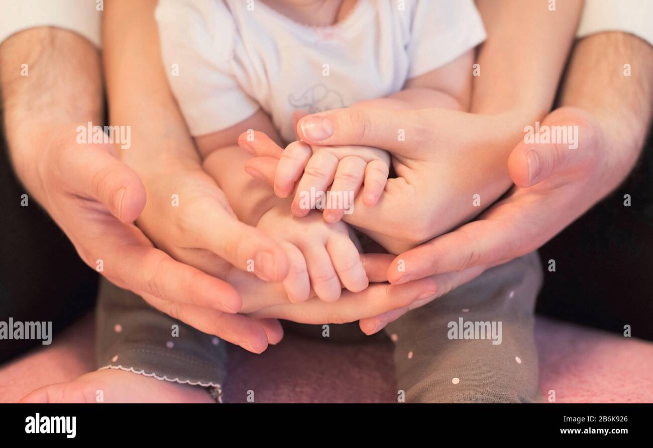 hands of complete family family: father, mother and child Stock Photo ...